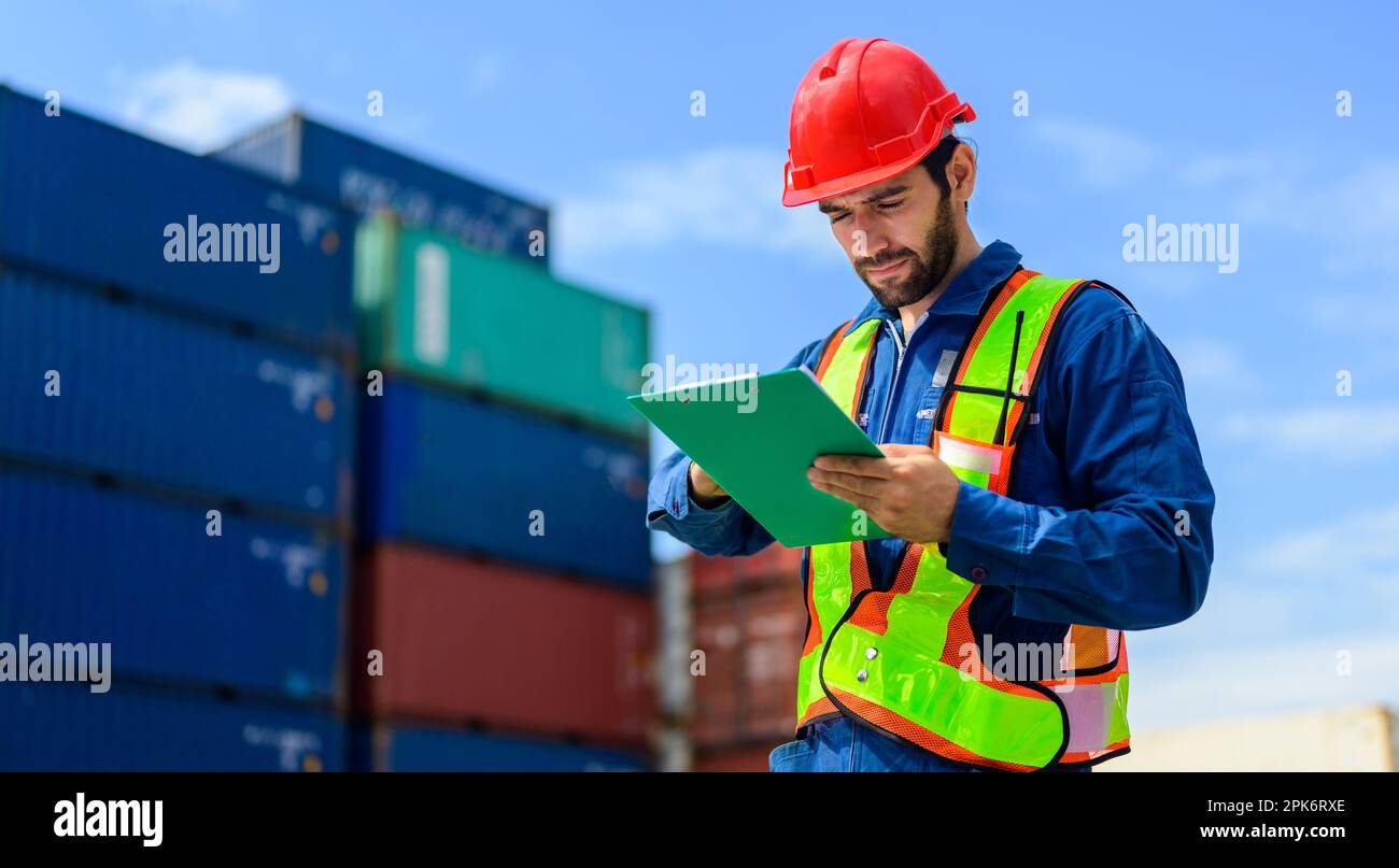 Warehouse engineer worker checking and working at industrial container ...
