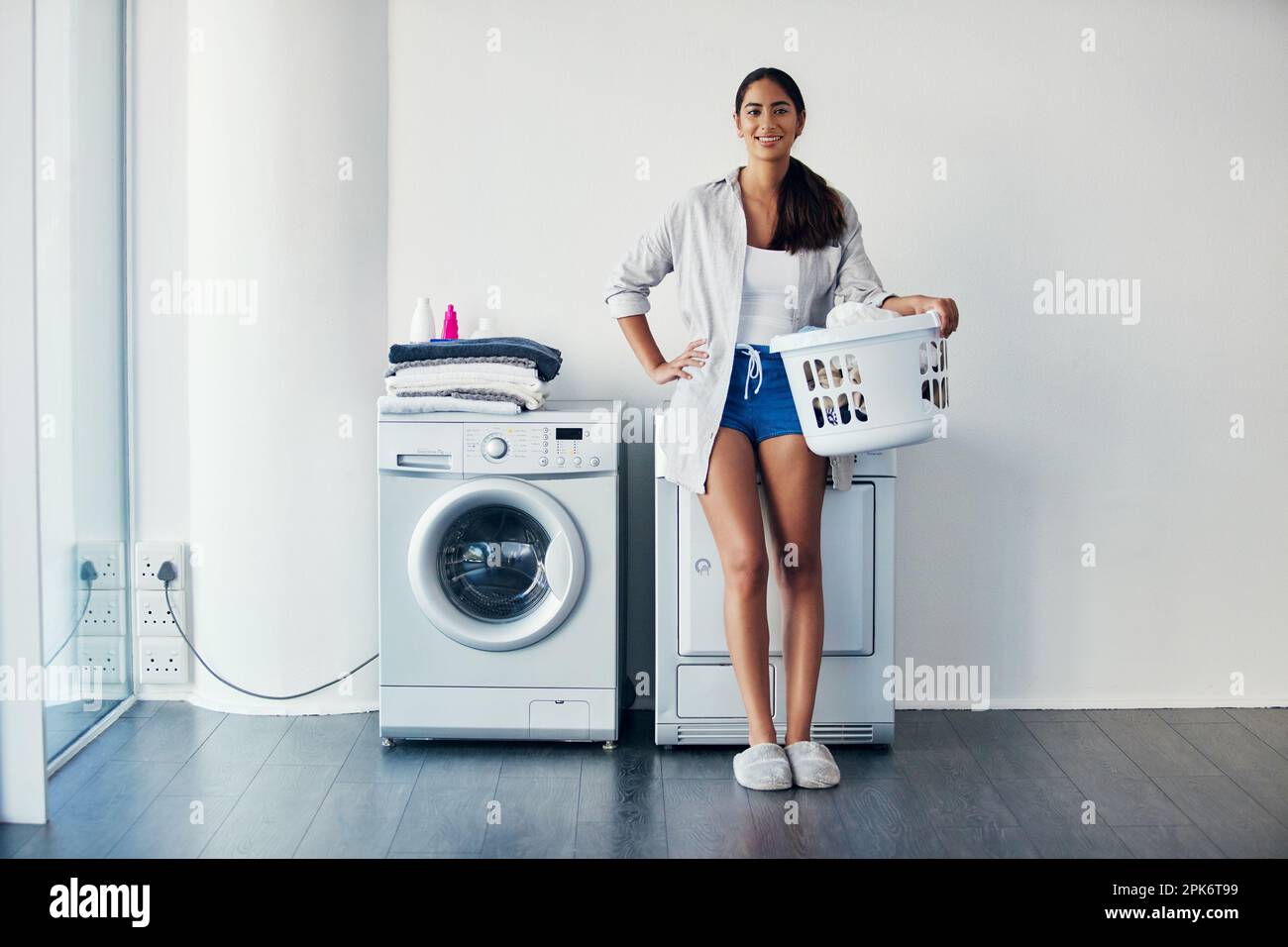 I like the feeling of accomplishment on laundry day. a young attractive ...