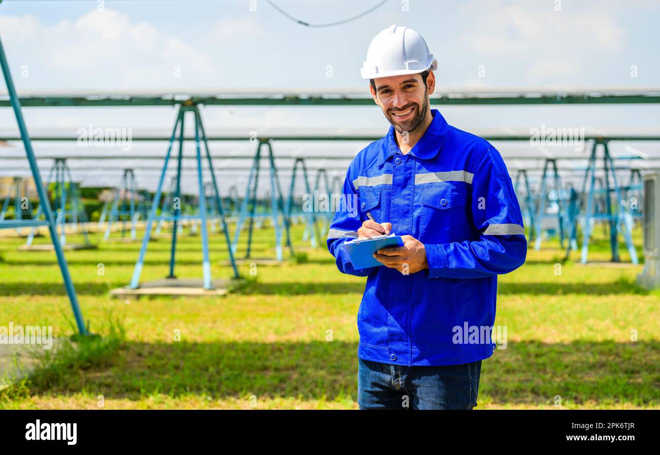 Workers installing solar panels, Engineer team at solar panel farm ...