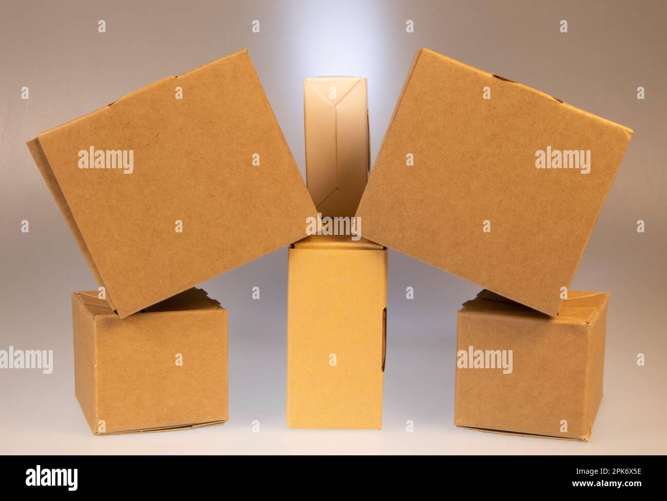 Little brown boxes in various formations on my light table Stock Photo ...