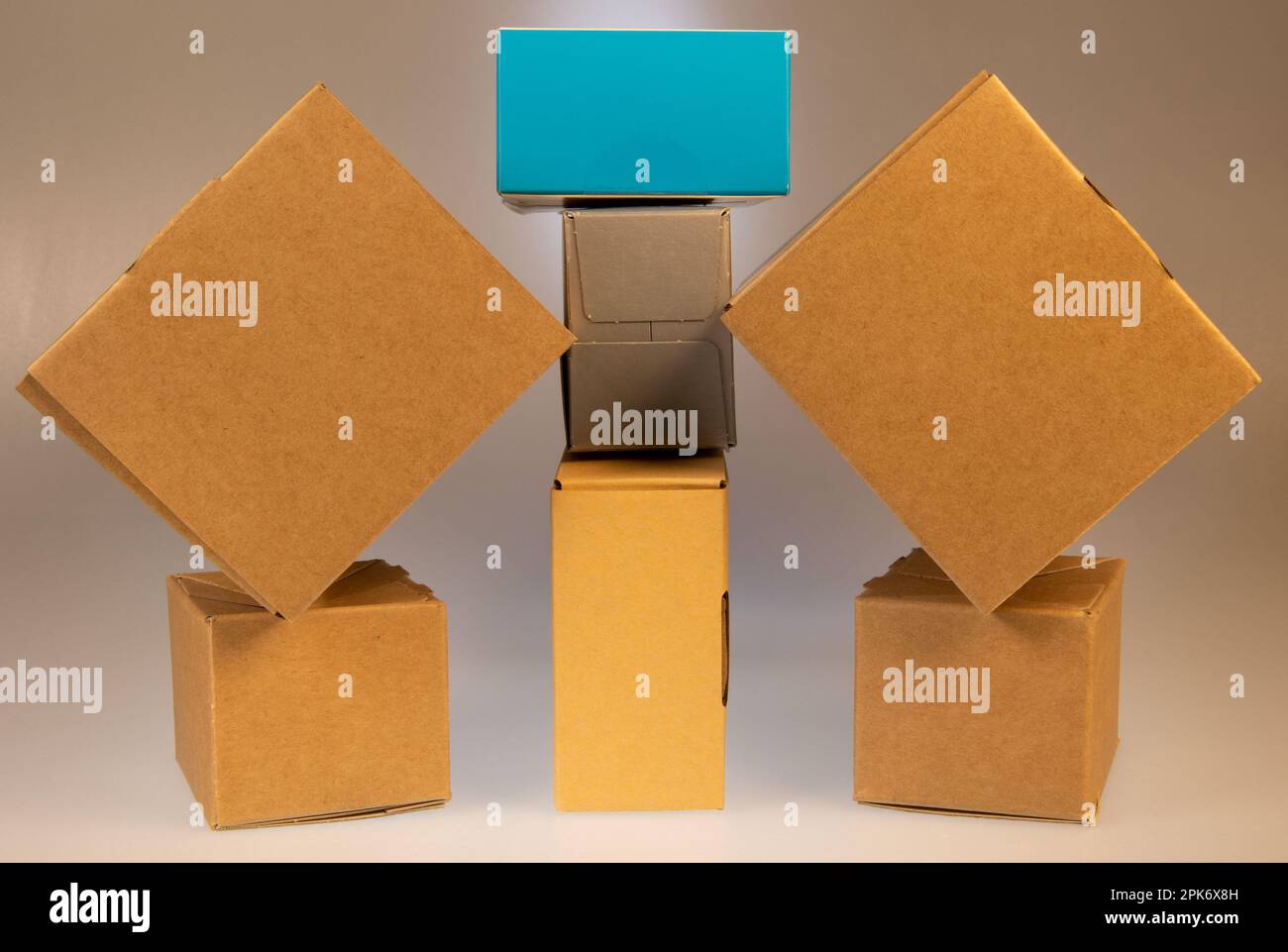 Little brown boxes in various formations on my light table Stock Photo ...