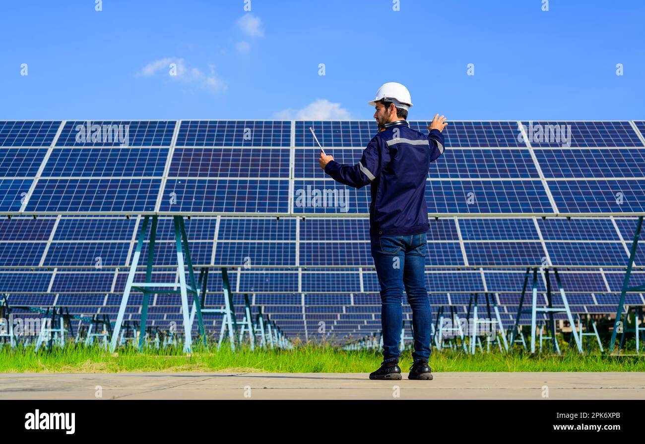 Engineer worker portrait with solar panel at solar farm Stock Photo - Alamy