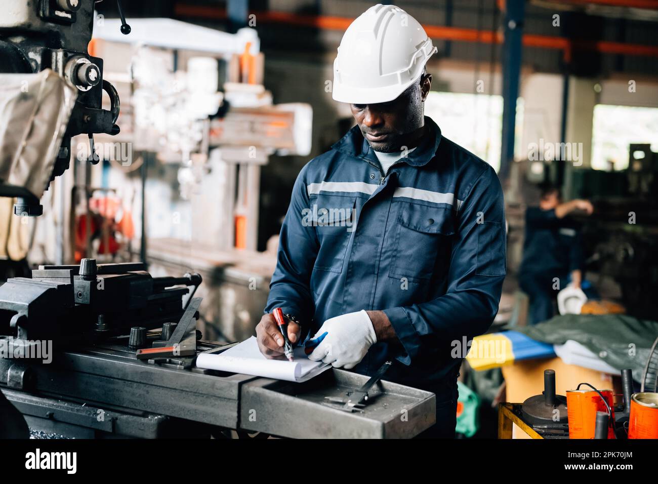 Professional male industrial worker in white hard hat working at ...
