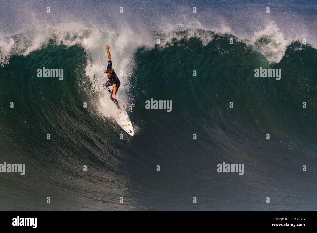 Man surfing on large wave, Newport Beach, California, USA Stock Photo ...