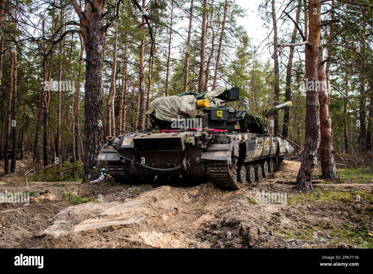 Ukrainian T-72B tank camouflaged in Lyman forest near the front line in ...