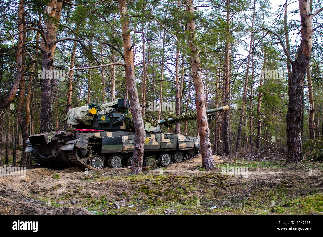Ukrainian T-72B tank camouflaged in Lyman forest near the front line in ...