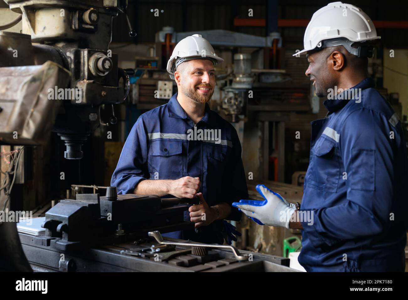 Two industrial engineers team with safety uniform Stock Photo - Alamy
