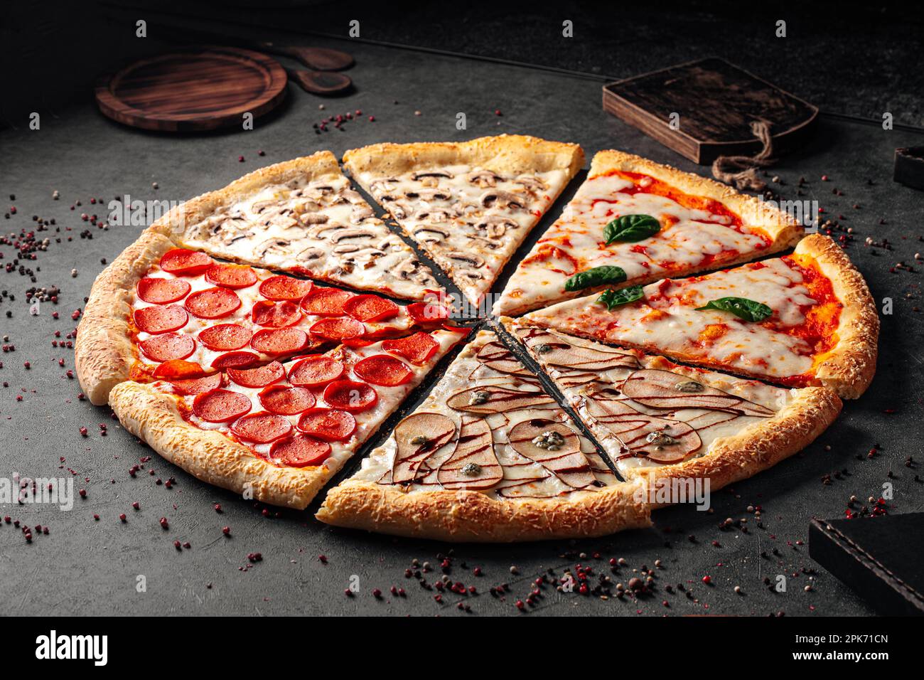 Big assorted pizza with variety of toppings Stock Photo - Alamy