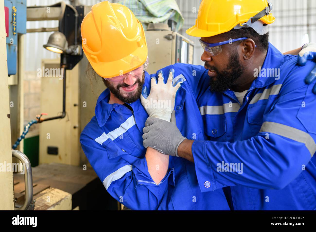 Engineer worker with accident at factory during working Stock Photo - Alamy
