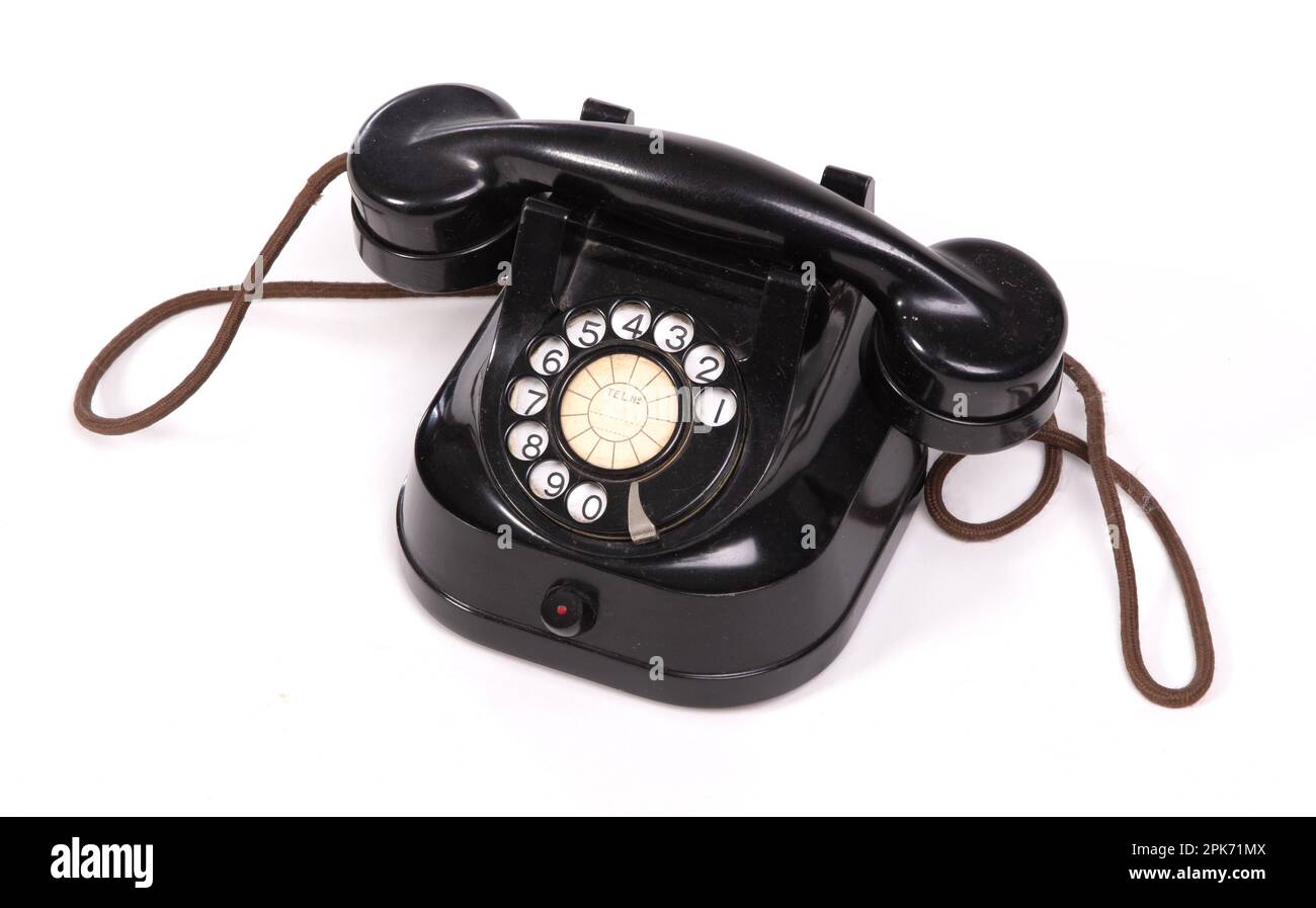 Old black telephone set isolated on a white background Stock Photo - Alamy