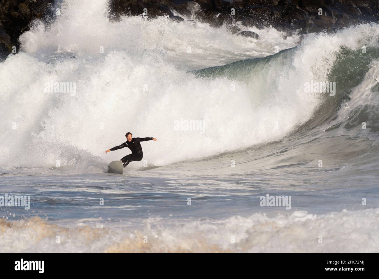 Man surfing on large wave, Newport Beach, California, USA Stock Photo ...