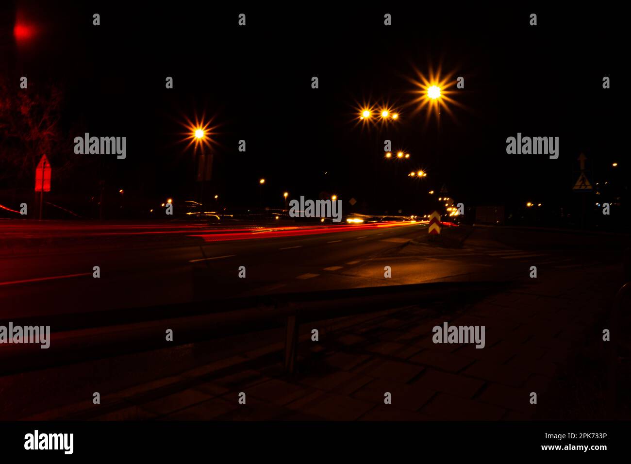Lights of cars at night. Street line lights. Night highway city. Long ...