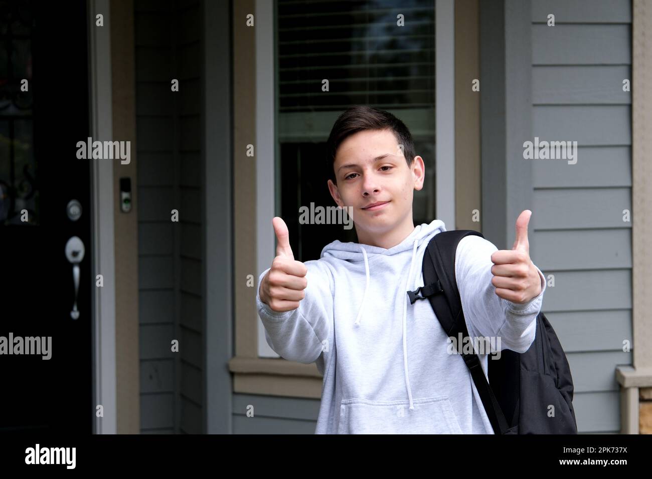 different emotions boy schoolboy shows thumbs up he likes something ...