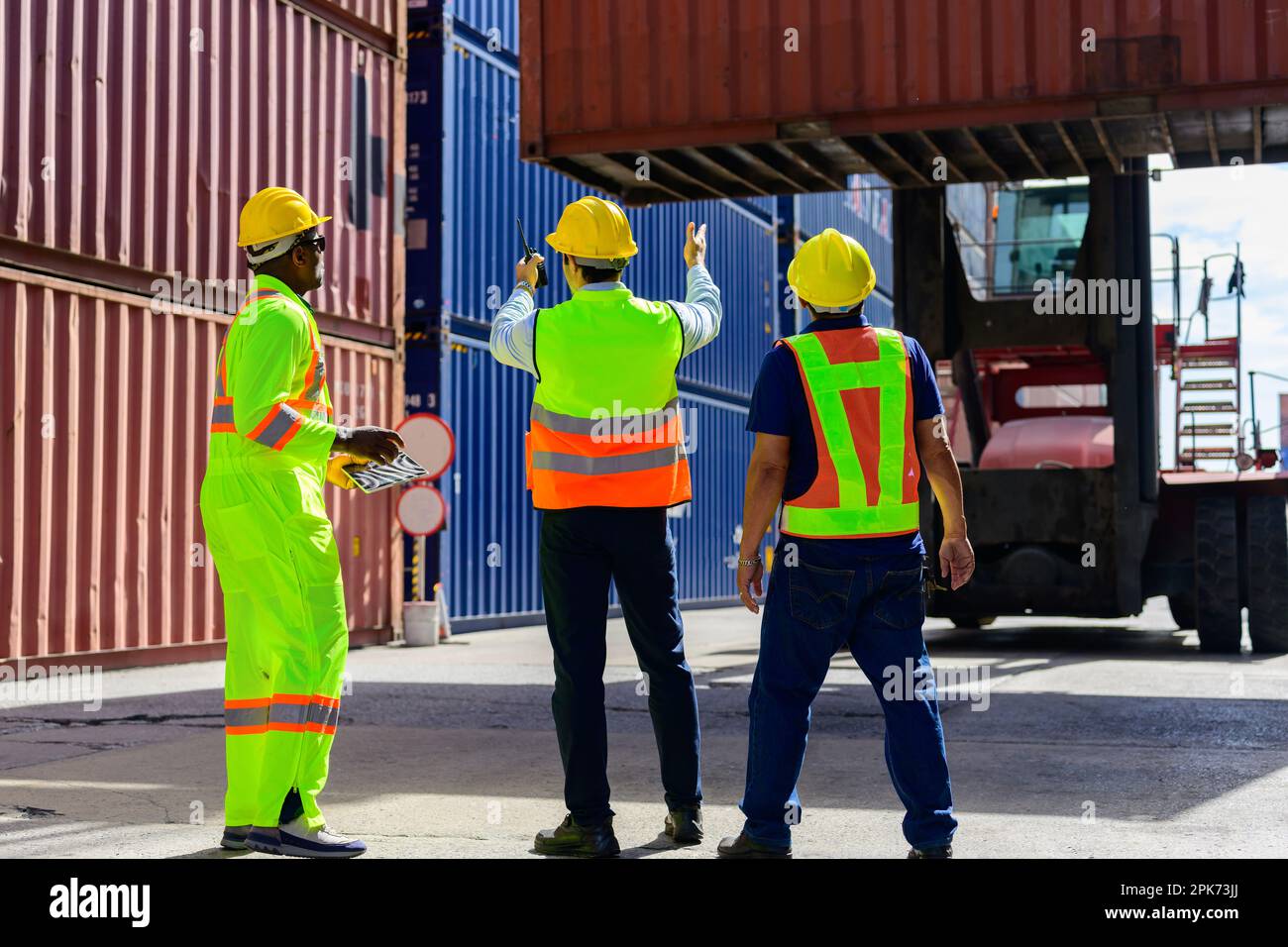 Group of teamwork warehouse worker working at cargo containers shipping ...