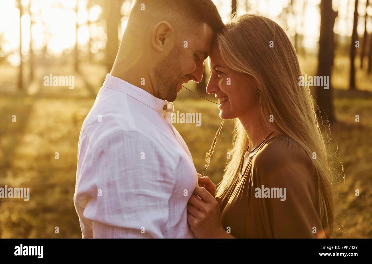 Close up view. Happy couple is outdoors in the forest at daytime Stock ...