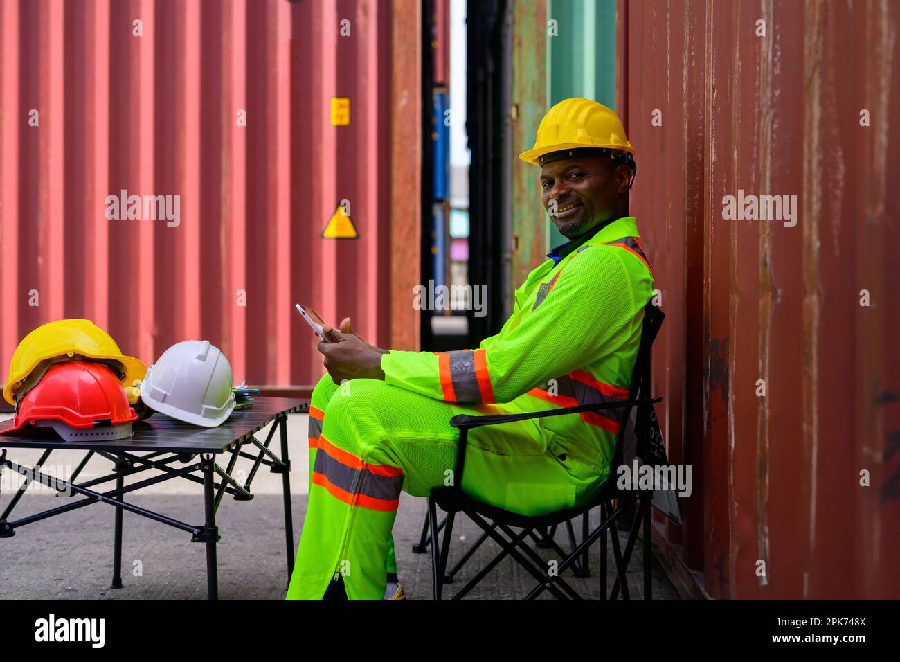 Warehouse engineer worker working at industrial container yard Stock ...