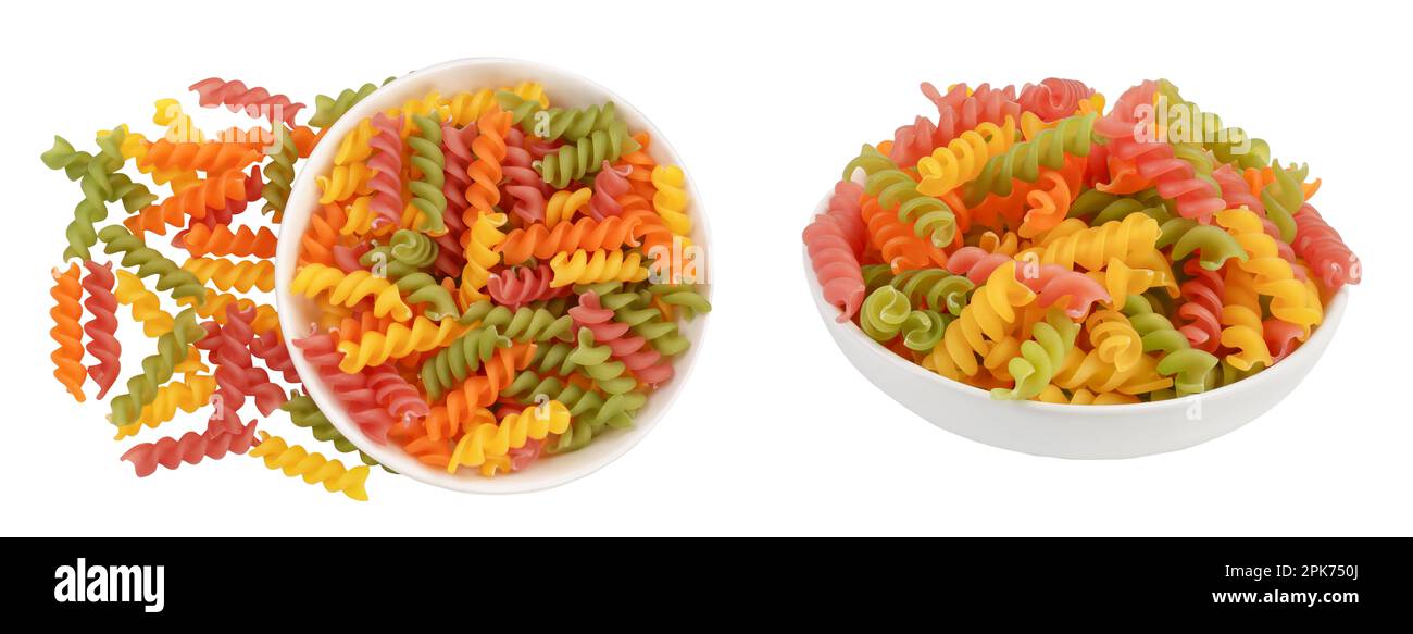 raw Fusilli colored pasta in ceramic bowl isolated on white background ...