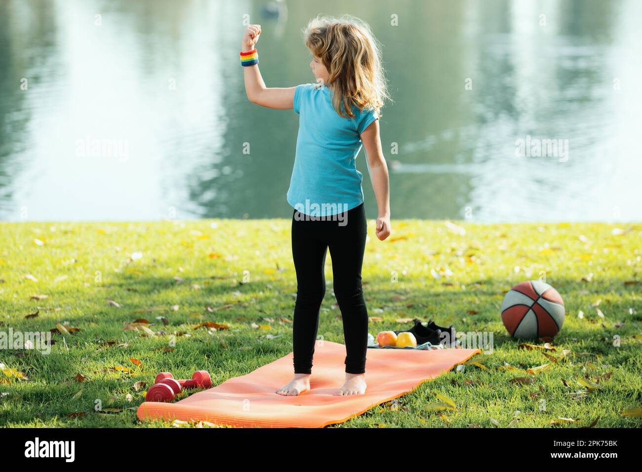 Sport children. Child with strong biceps muscles. Sport exercise for kids. Sporty children ...