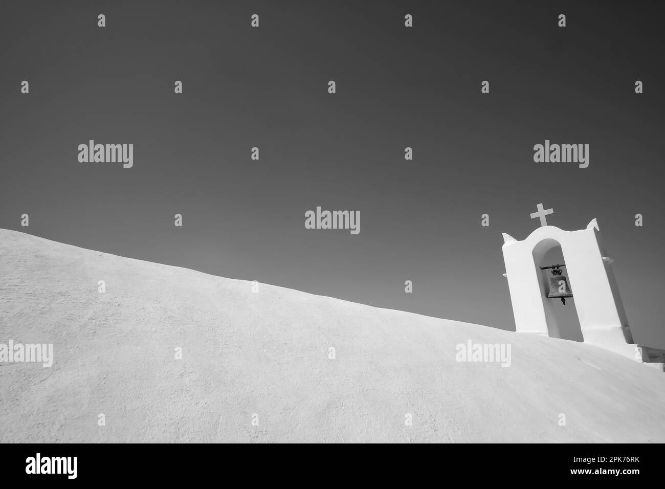 A cross on the top of an orthodox whitewashed church in Ios Greece and ...