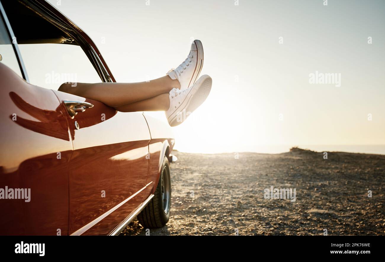 Sit back and slow down. an unrecognizable womans legs sticking out the ...