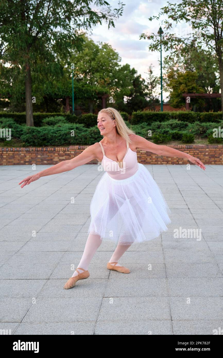 Lady dancing ballet in a park at street Stock Photo - Alamy