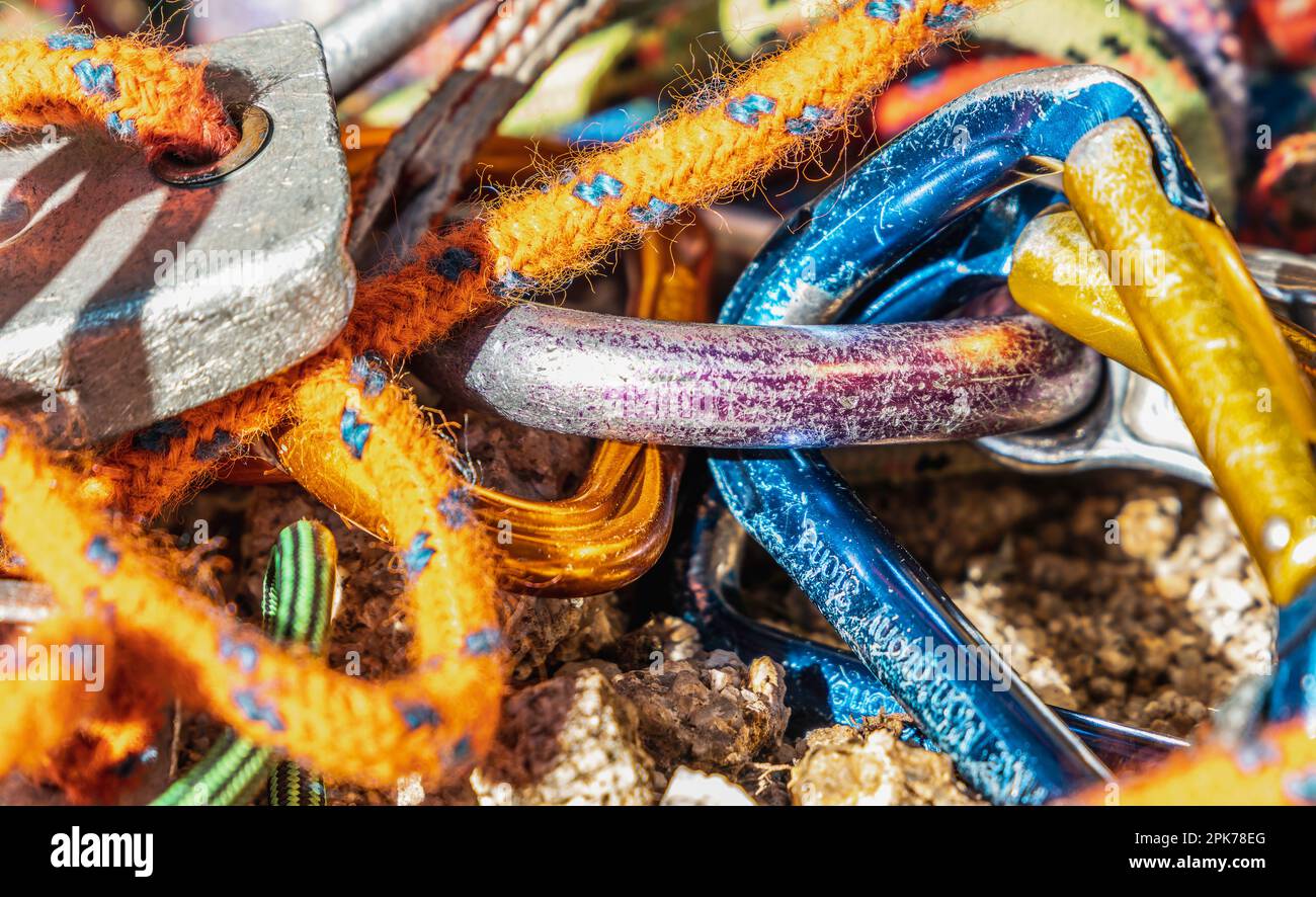 Close up of worn rock climbing gear. Equipment belaying carabiners ...