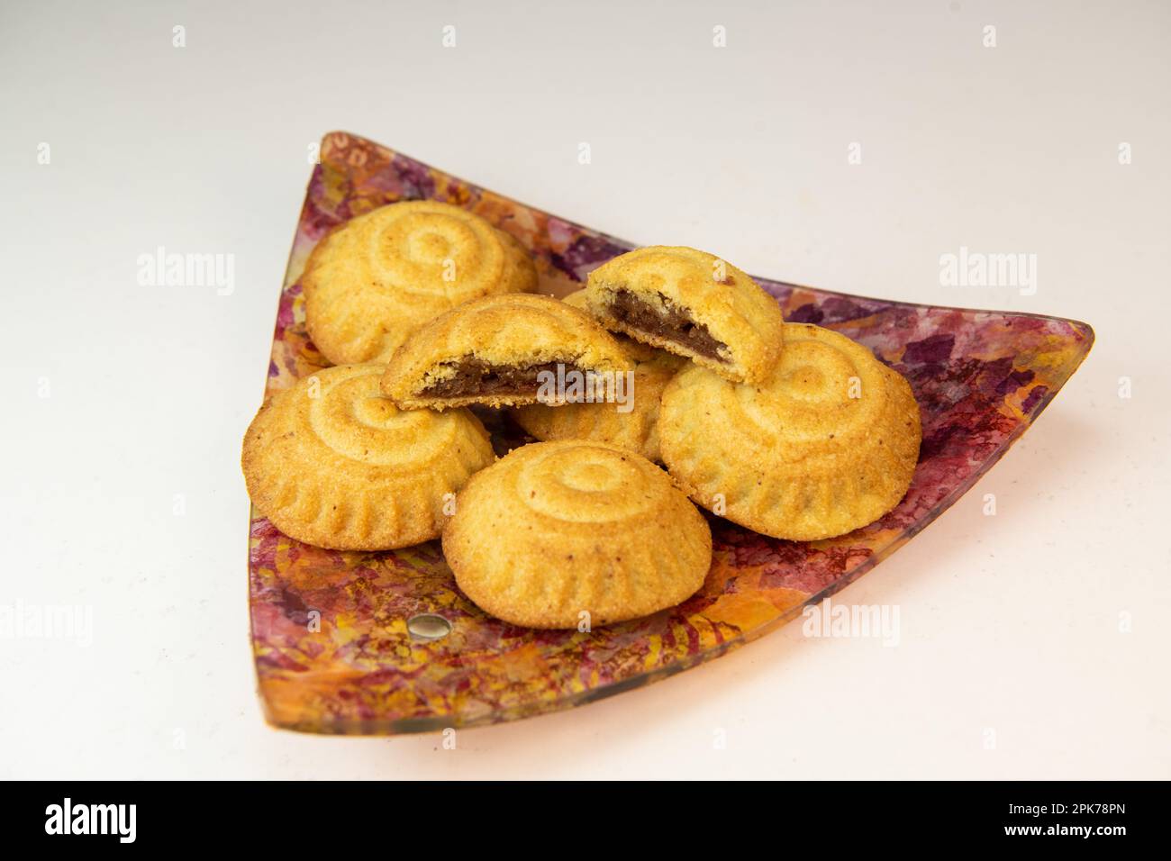 Traditional eid maamoul or mamoul cookies with dates, nuts, and jam ...
