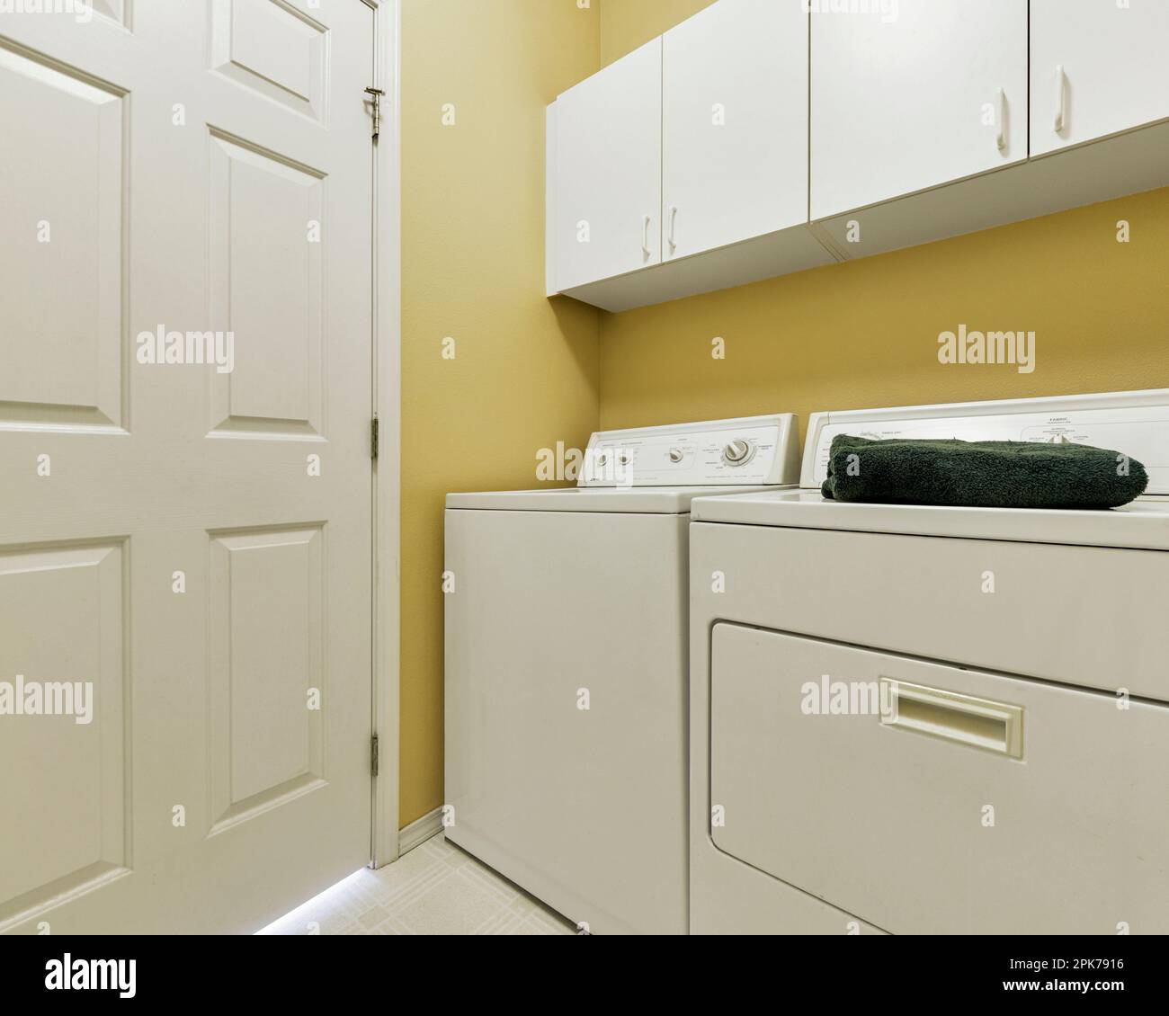 Modern residential laundry room interior Stock Photo - Alamy
