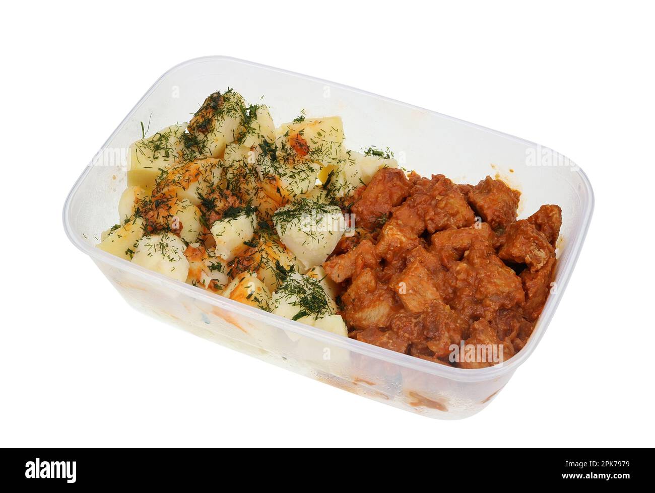 Homemade meat stew with boiled potatoes in a plastic container ...