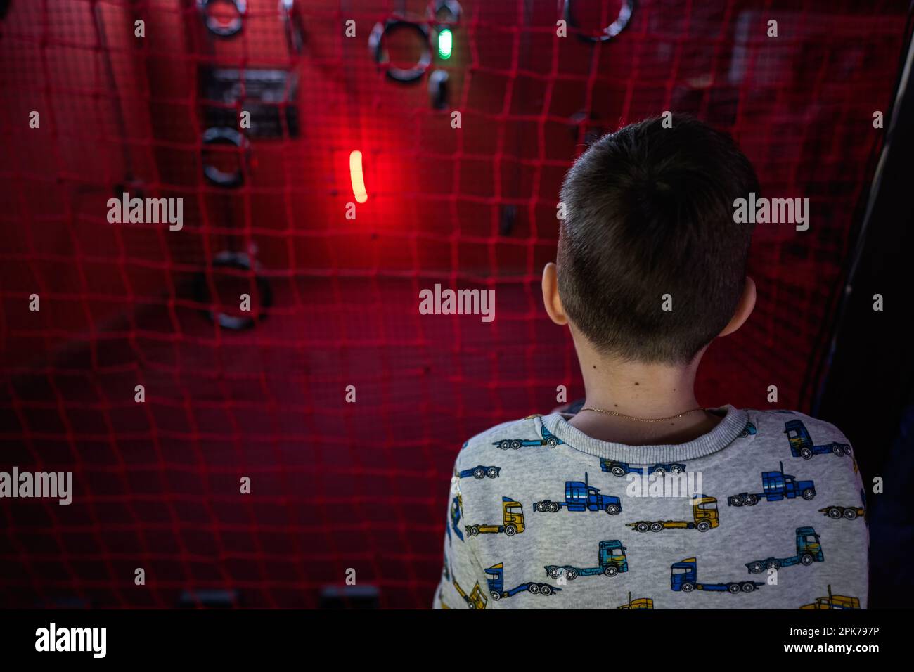 Boy flying remote control drones game indoor play zone Stock Photo - Alamy