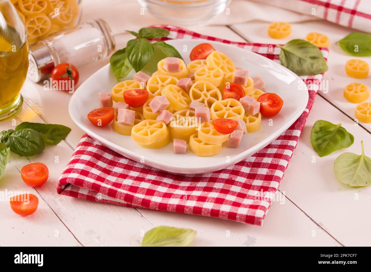 Ruote pasta with tomato and ham Stock Photo - Alamy
