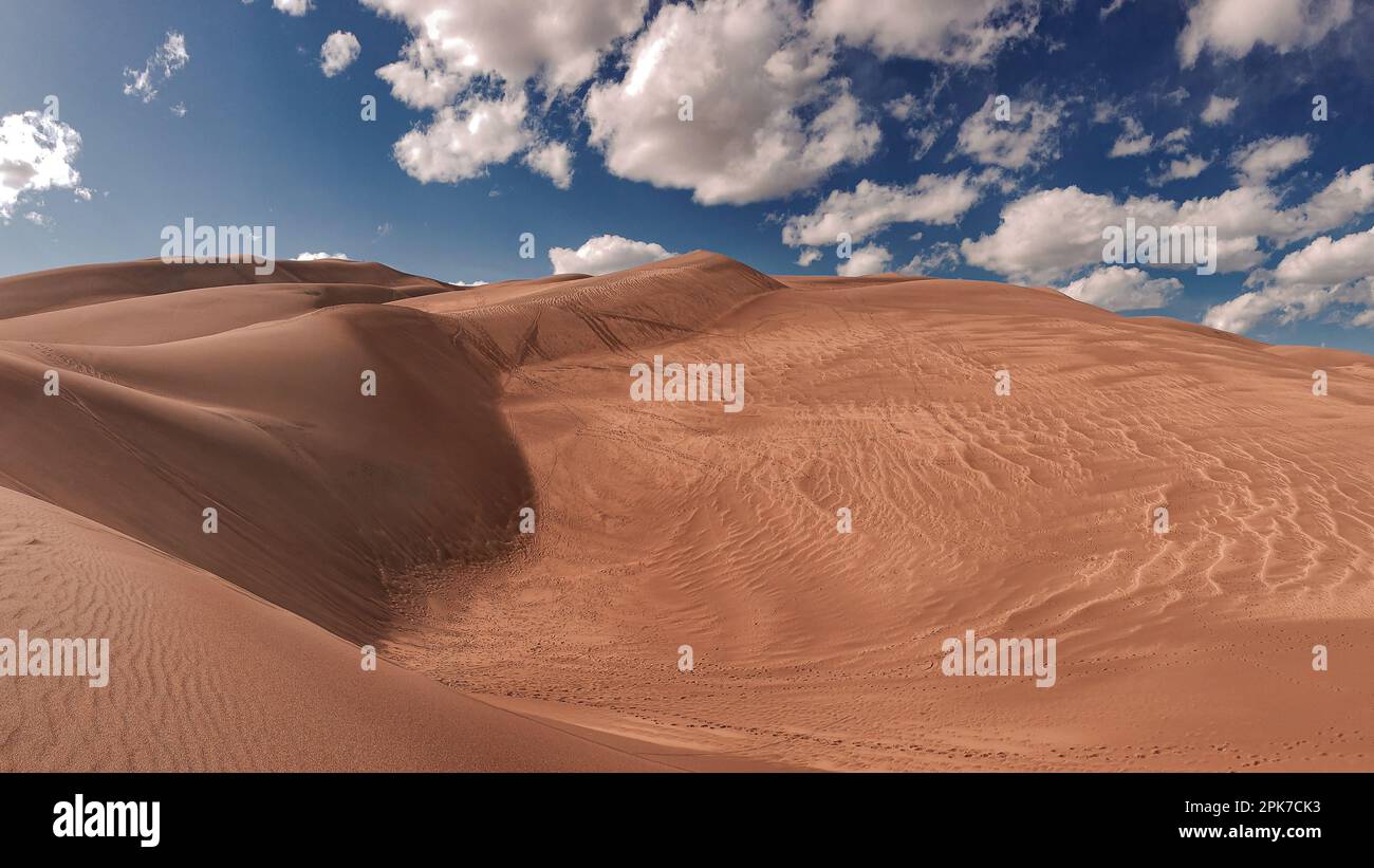 Sunny landscape of a desert, with sandy terrain and clear blue sky ...