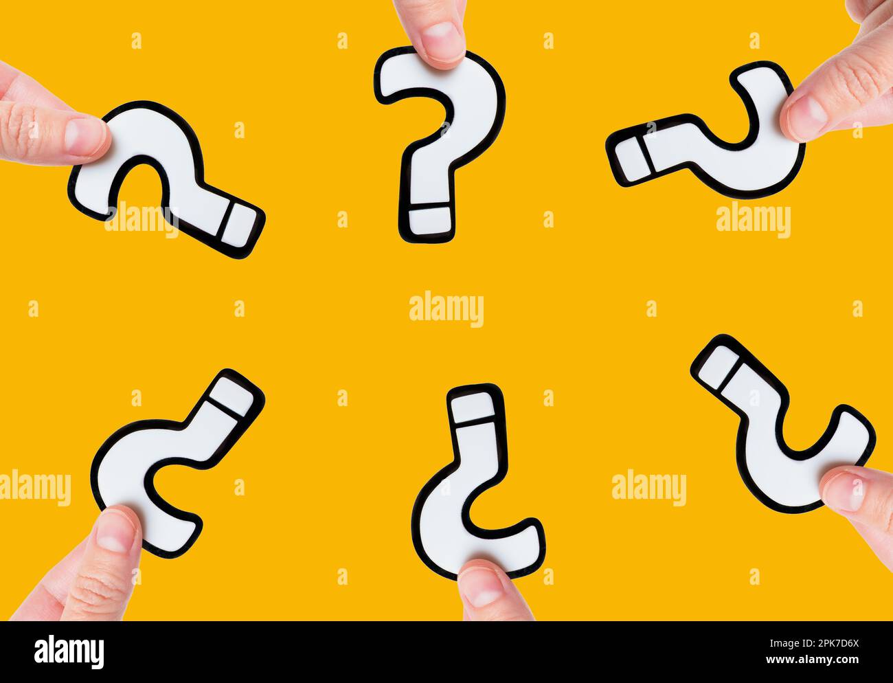 Close-up view of a group of white and black plastic question marks in ...