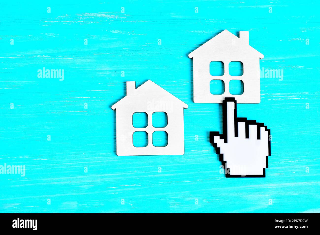 Bright blue background with two flat house shapes and a hand pointer ...