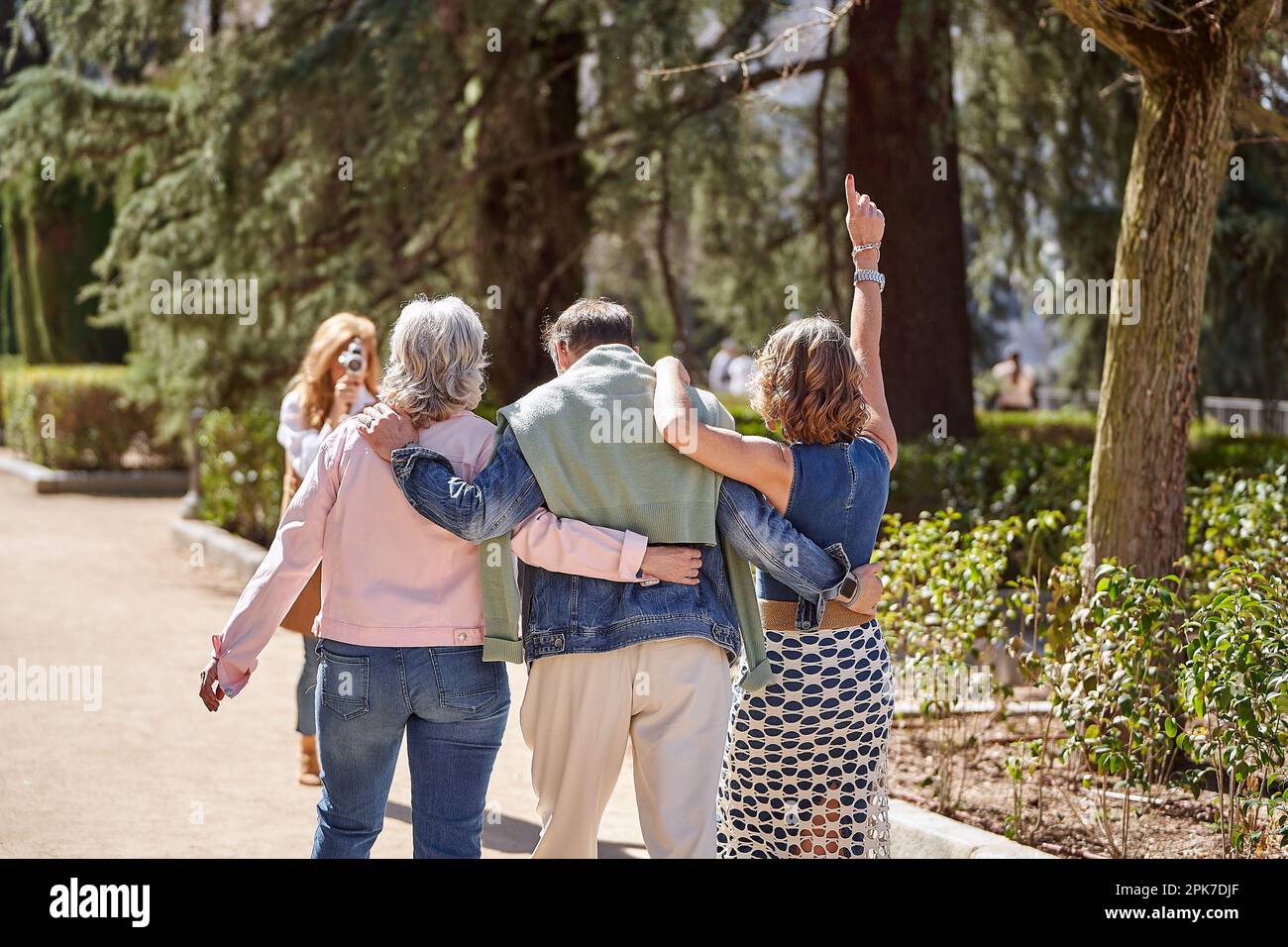 A man with a vintage video camera captures memories with his three ...