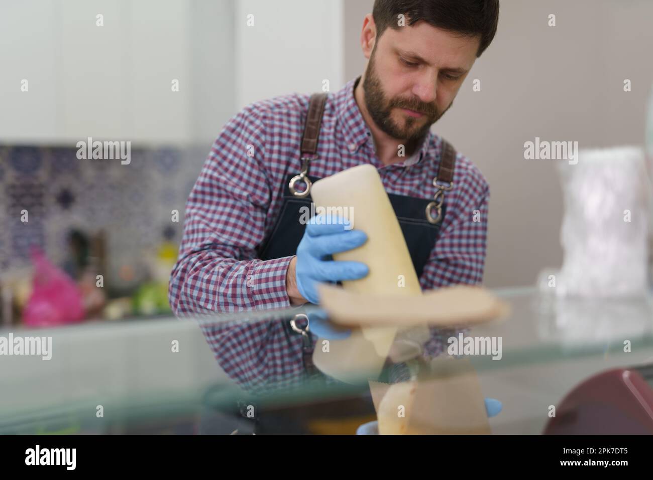 Portrait of a handsome white man cooking sandwich in a Greek fast food ...
