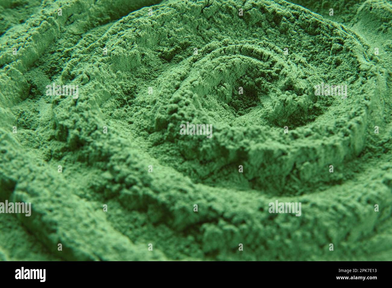 Chlorella or spirulina algae green powder is spinning, rotation ...