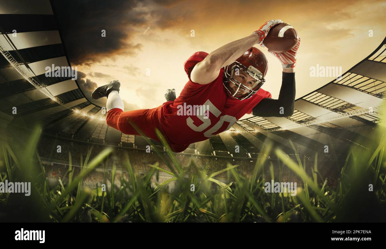 American football player in sports uniform and protective equipment ...