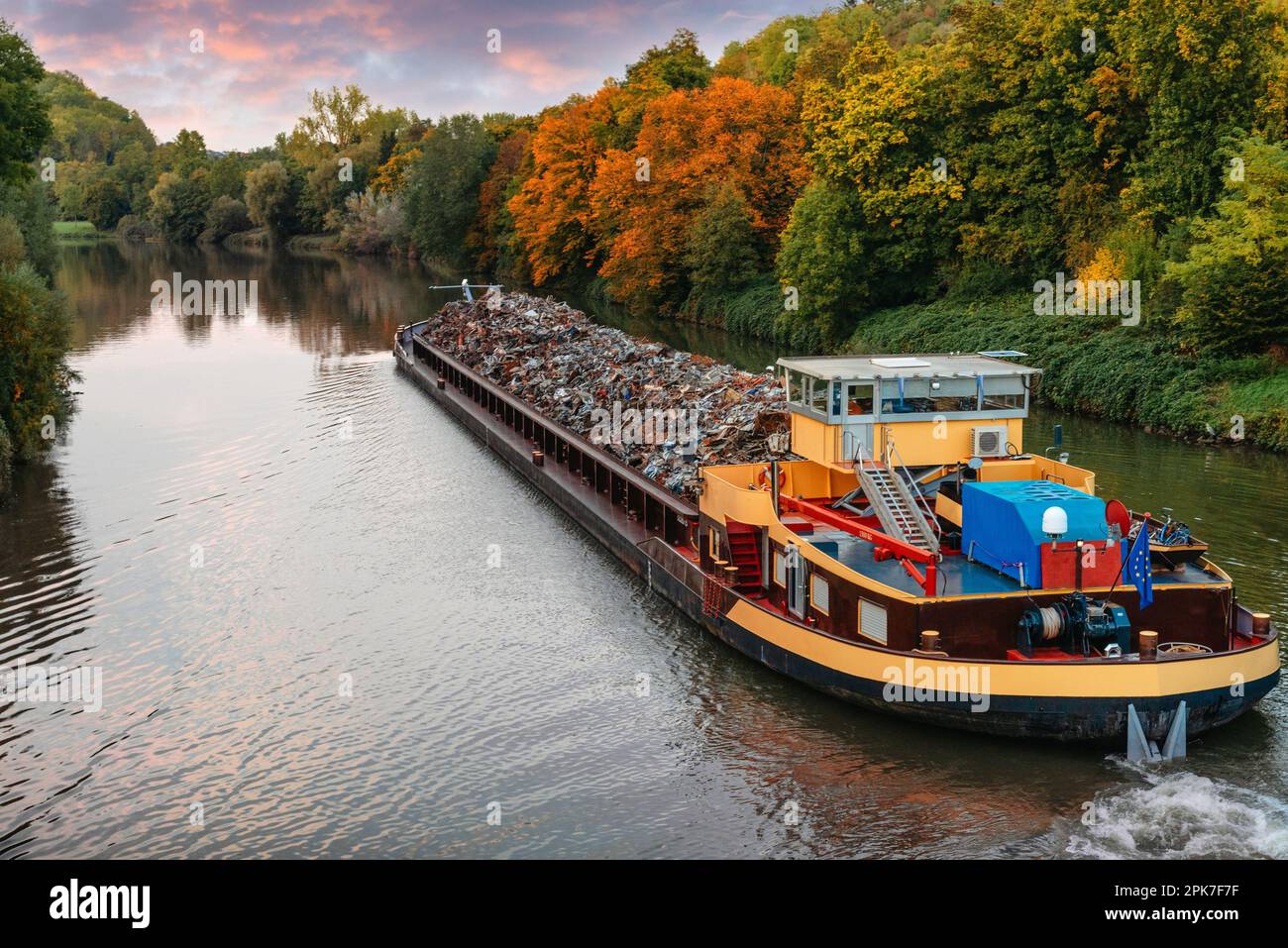 Transportation industry. Ship barge transports scrap metal and sand ...