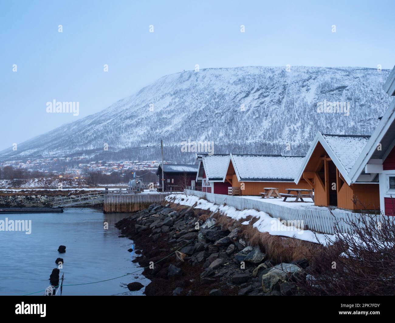 Tromso, Norway - January 2020: Wooden huts in Tromsdalshavna marina ...