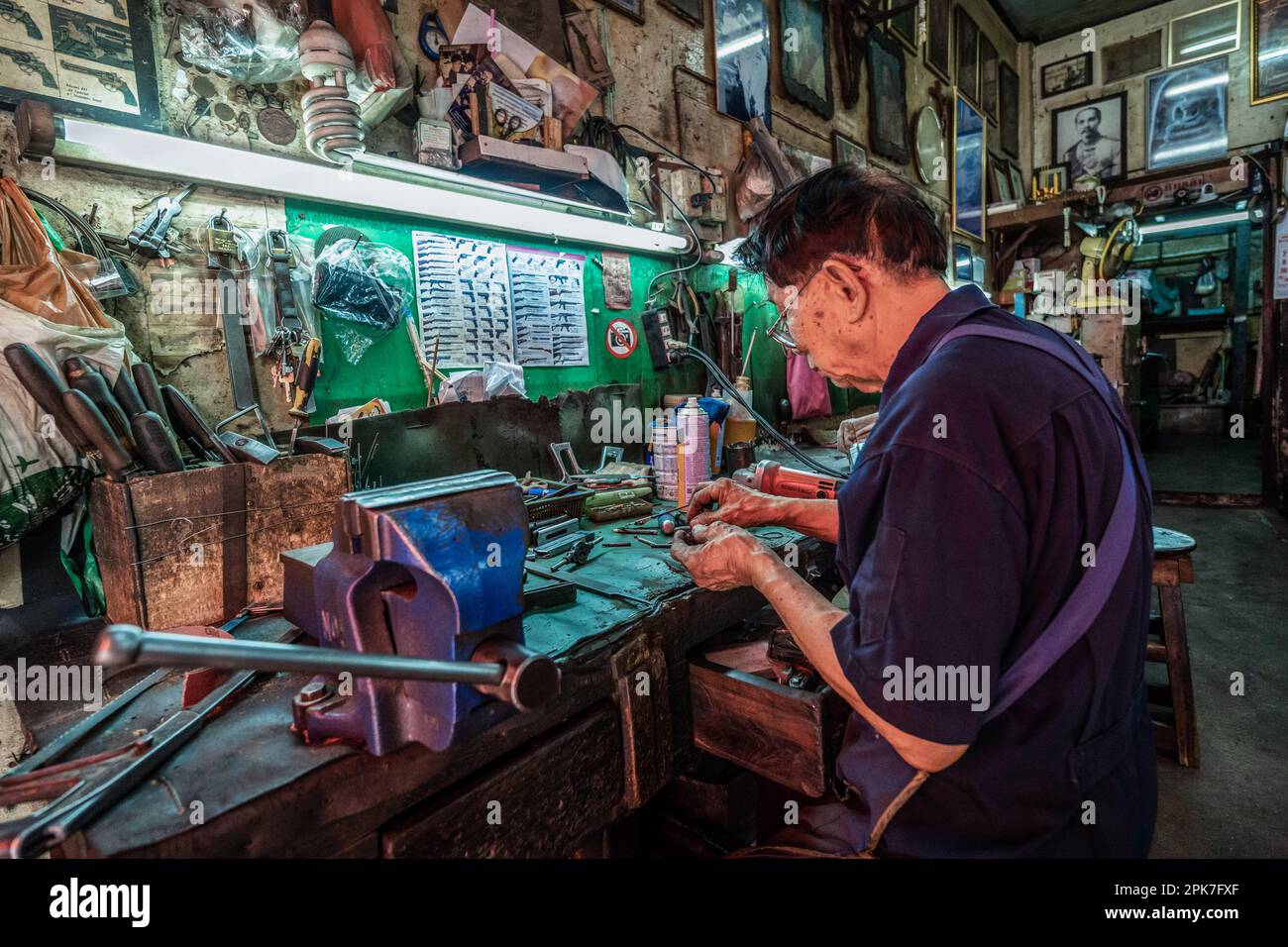 Bangkok, Thailand. 05th Apr, 2023. A gunsmith is repairing a firearm ...