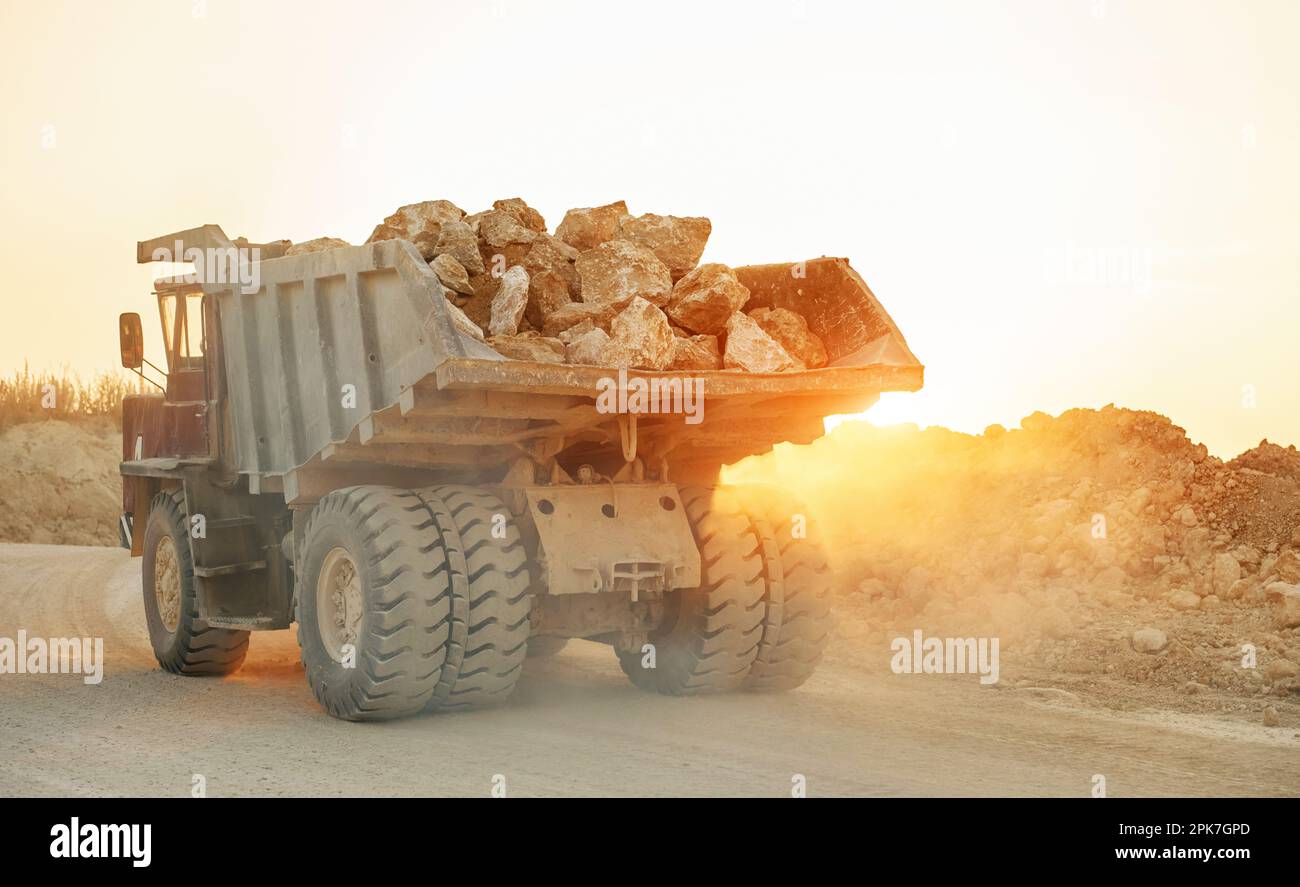 Beautiful sunshine. Loading vehicle is outdoors on the borrow pit at ...