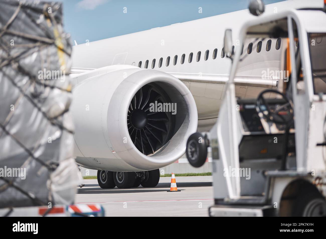 Preparation airplane at airport. Loading of cargo containers against ...
