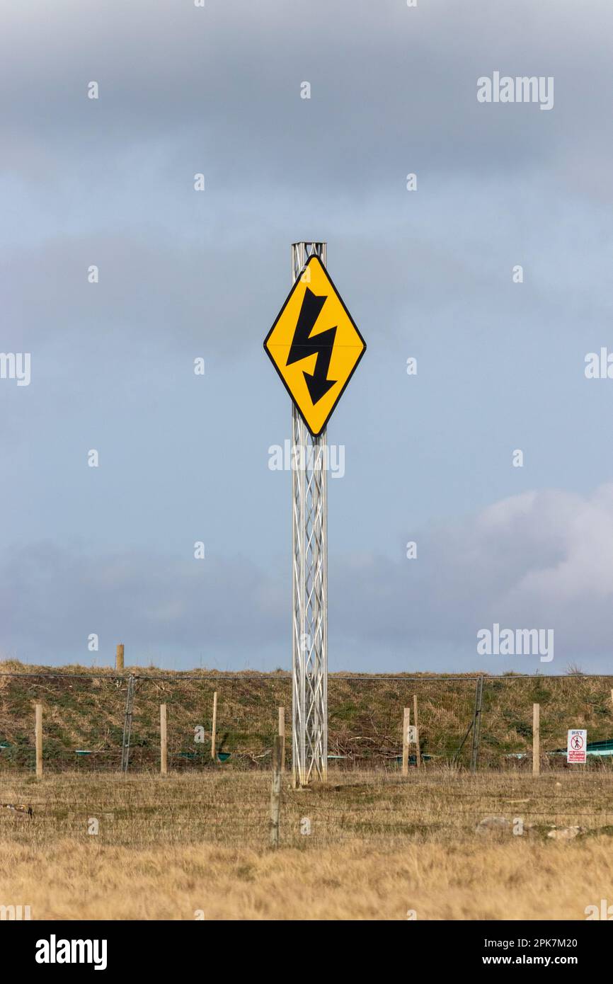 A warning sign for high voltage electricity in a field near Wick ...