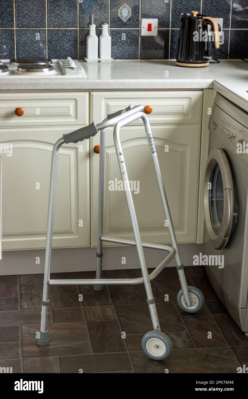 A zimmer frame next to a washing machine in a domestic kitchen Stock ...