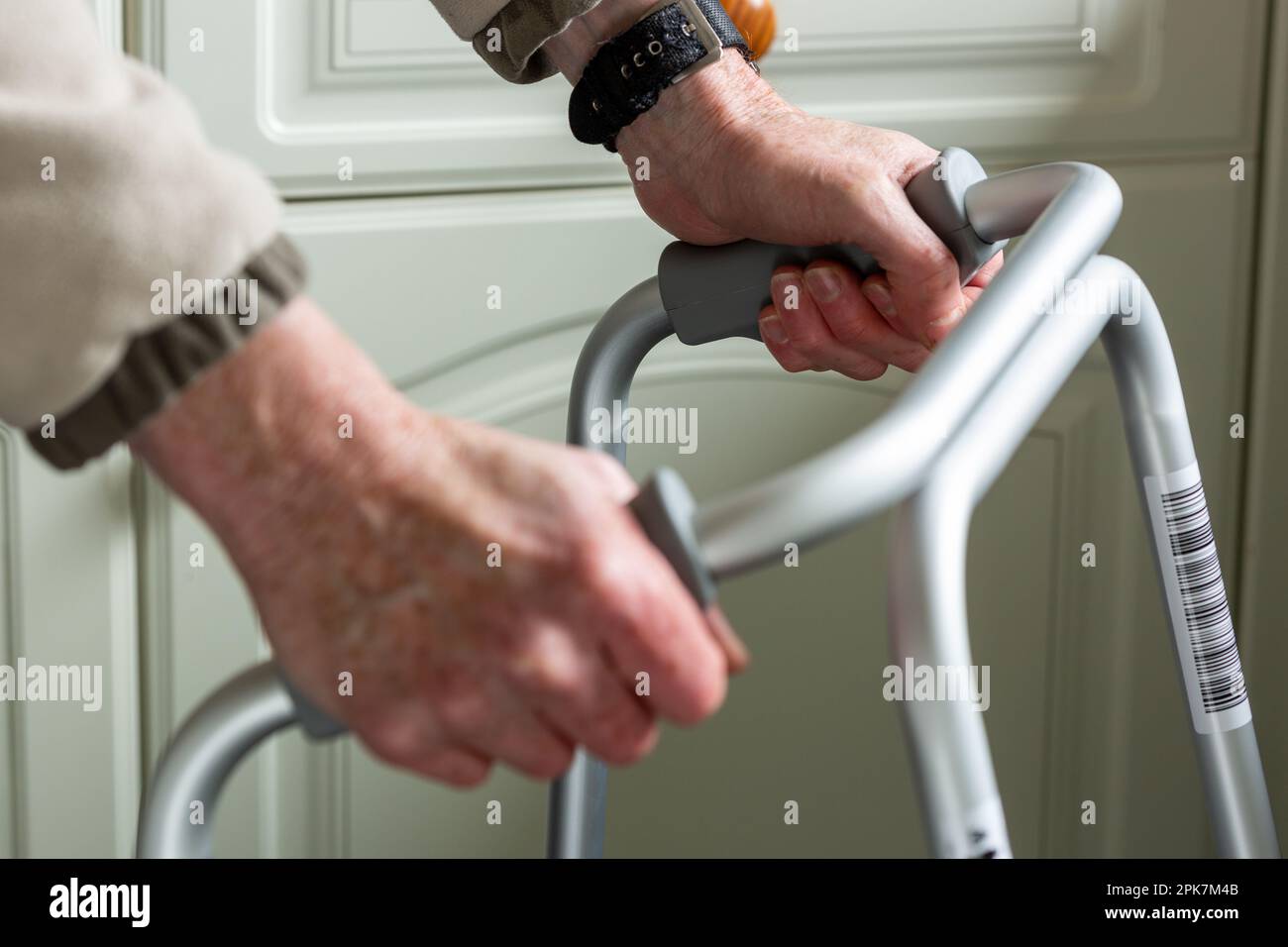 Close up of hands on a zimmer frame Stock Photo - Alamy