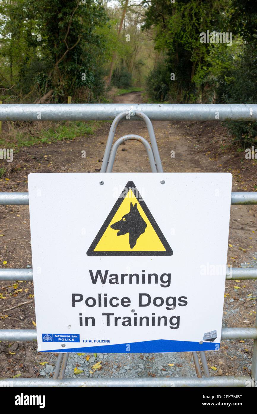 Warning Police Dogs in Training sign, UK Stock Photo - Alamy