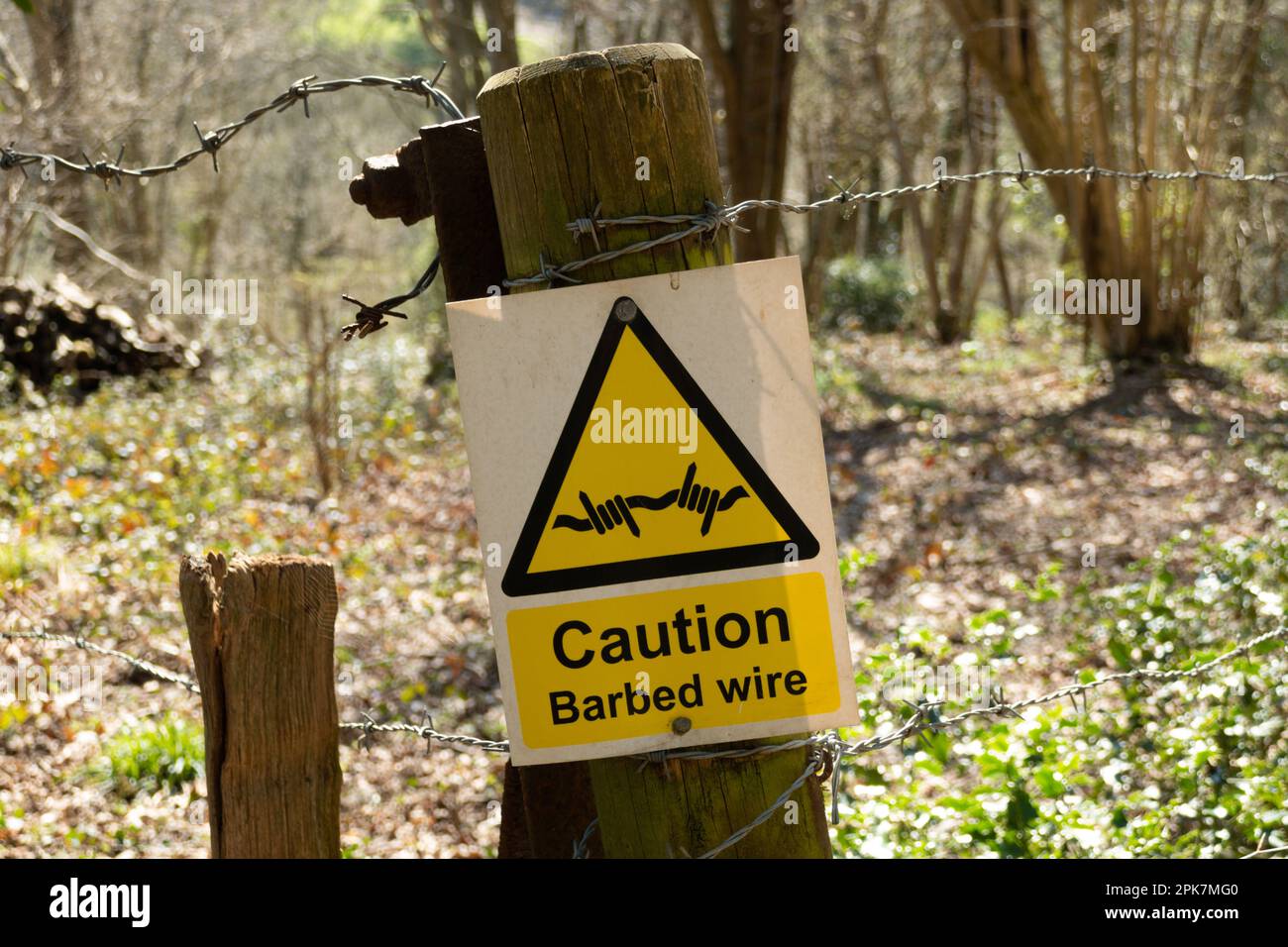 Caution Barbed Wire sign, UK Stock Photo - Alamy