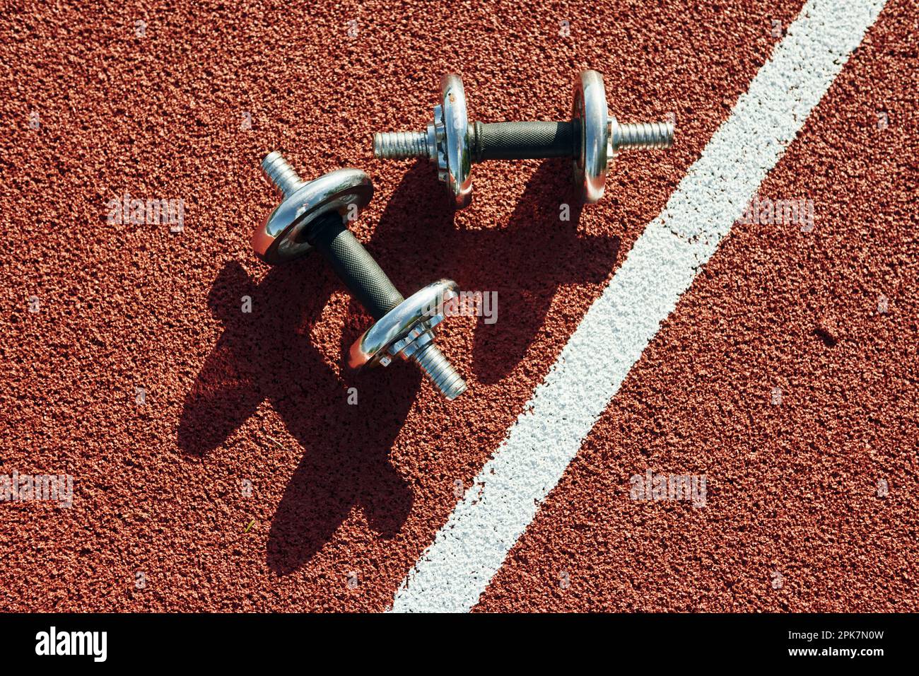 Top view of dumbbells that is on the ground Stock Photo - Alamy