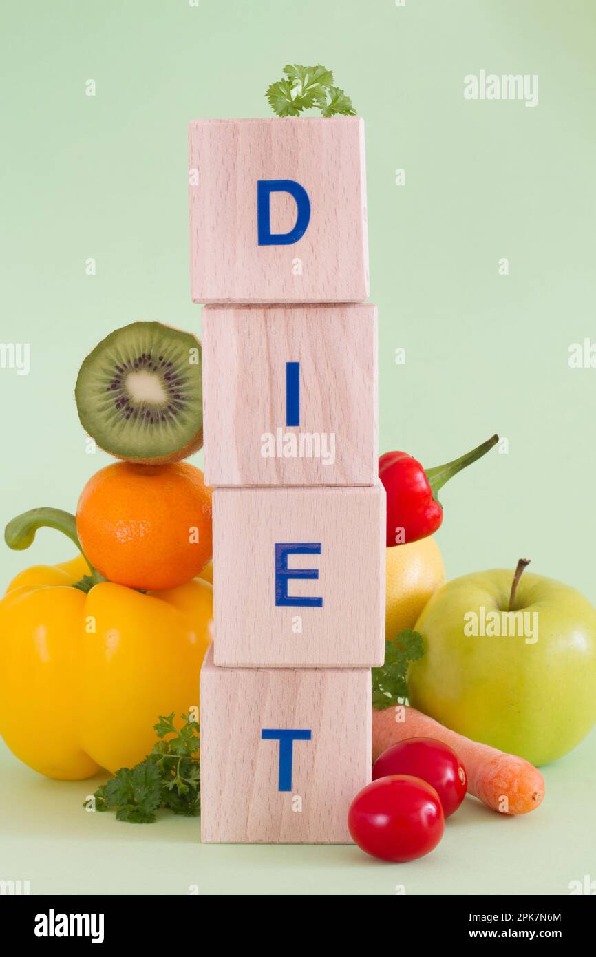 Word DIET made with wooden blocks. Fruits and vegetables, healthy diet ...